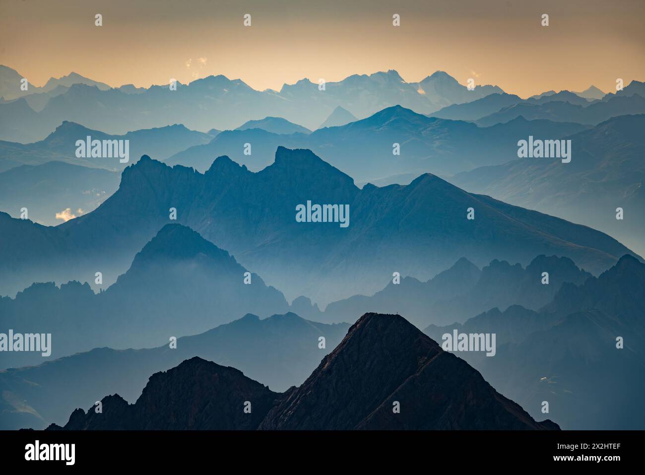 Stylized silhouette of mountain landscape with one single summit cross ...