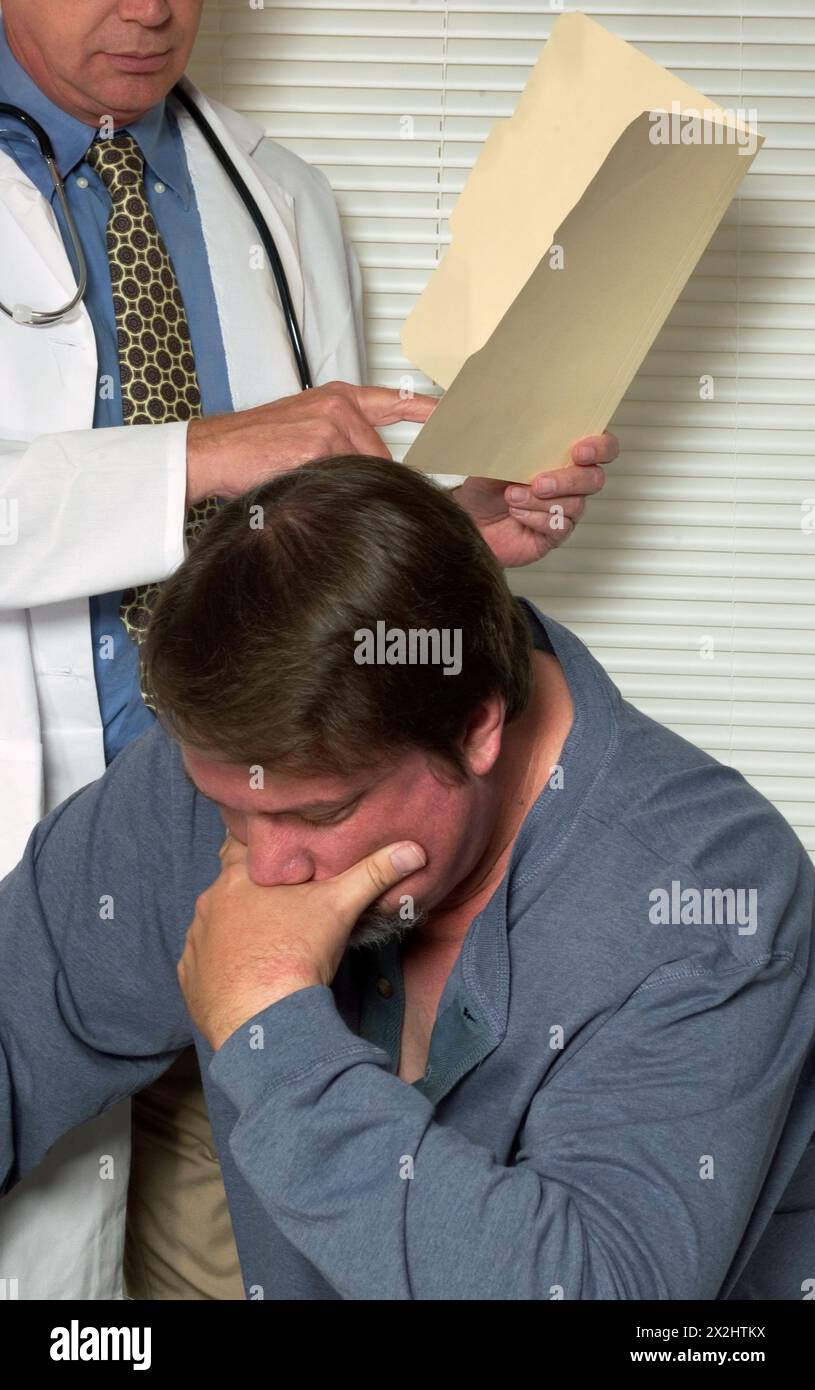 Doctor giving bad diagnosis young hi-res stock photography and images ...