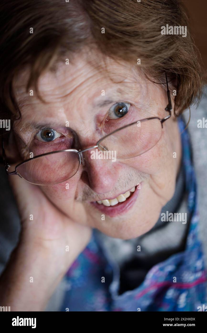 Senior citizen supports her head in her hand, portrait, Cologne, North ...