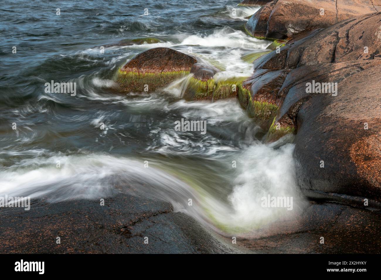 Red granite, rocky coast, surf, long exposure, Havsvidden, Geta, Aland ...