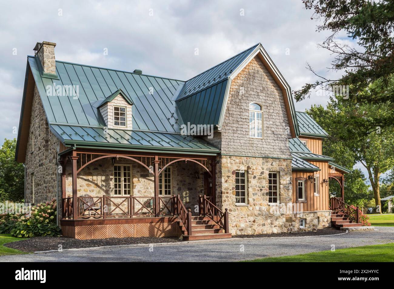 Old 1826 Canadiana cottage style fieldstone house facade with vertical ...