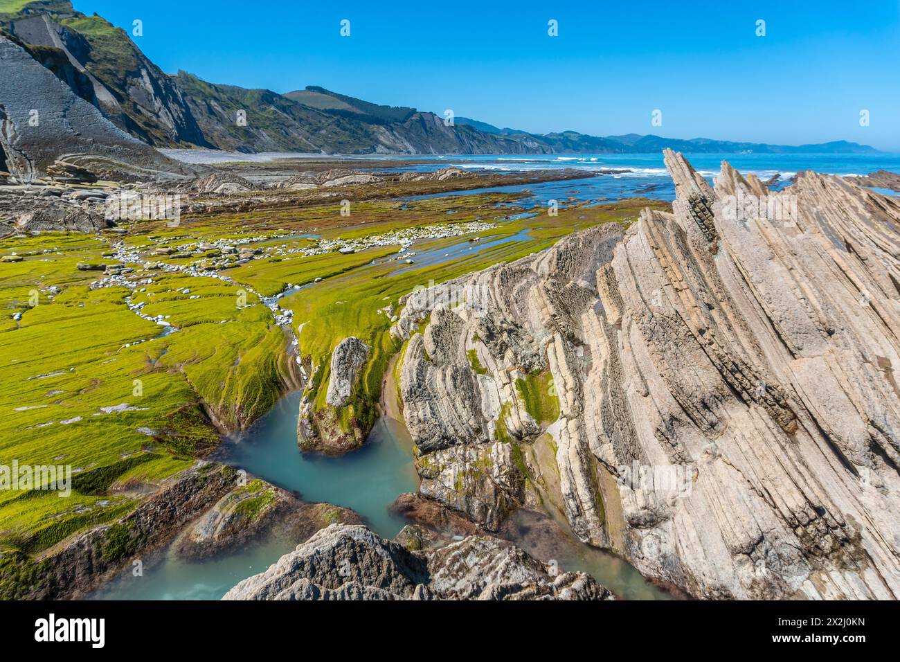 Landscape of the Flysch Basque Coast geopark in Zumaia with low seas ...