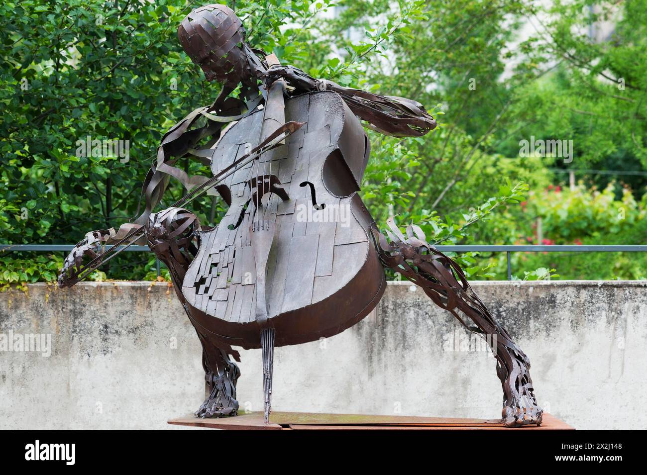 Metal sculpture, man with a cello, Langeais, France Stock Photo - Alamy