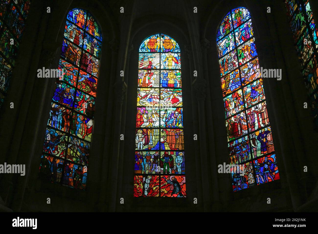 Choir chapel stained glass window with motifs from the life of Joan of ...
