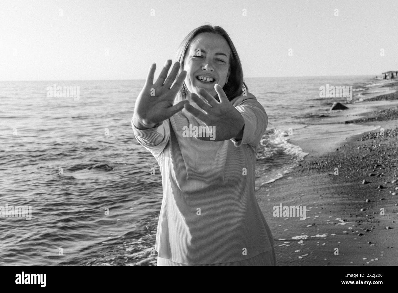 On sand ocean edge Black and White Stock Photos & Images - Alamy