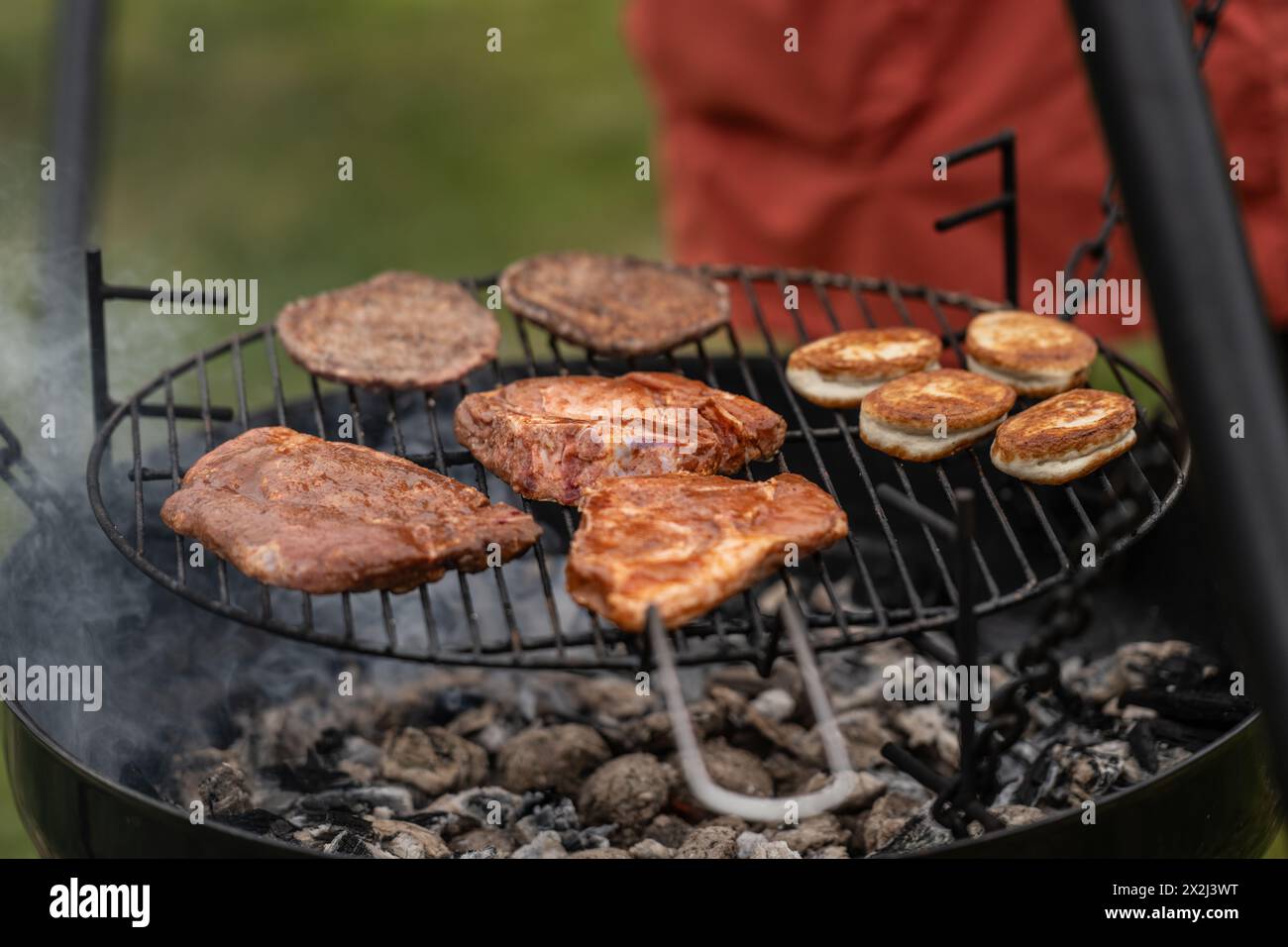 Different meats on a barbecue Stock Photo - Alamy