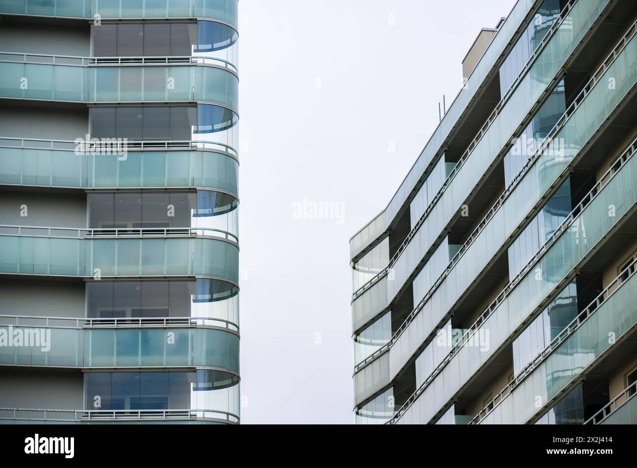 Rounded corner balconies on two apartment buildings Stock Photo - Alamy