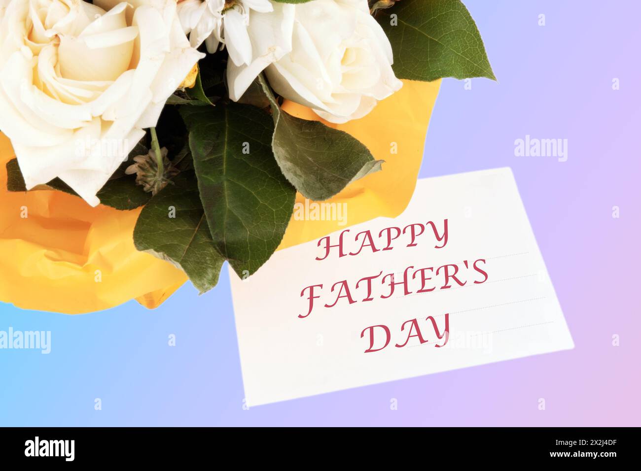 HAPPY FATHER'S DAY text on the card near the bouquet of flowers Stock ...