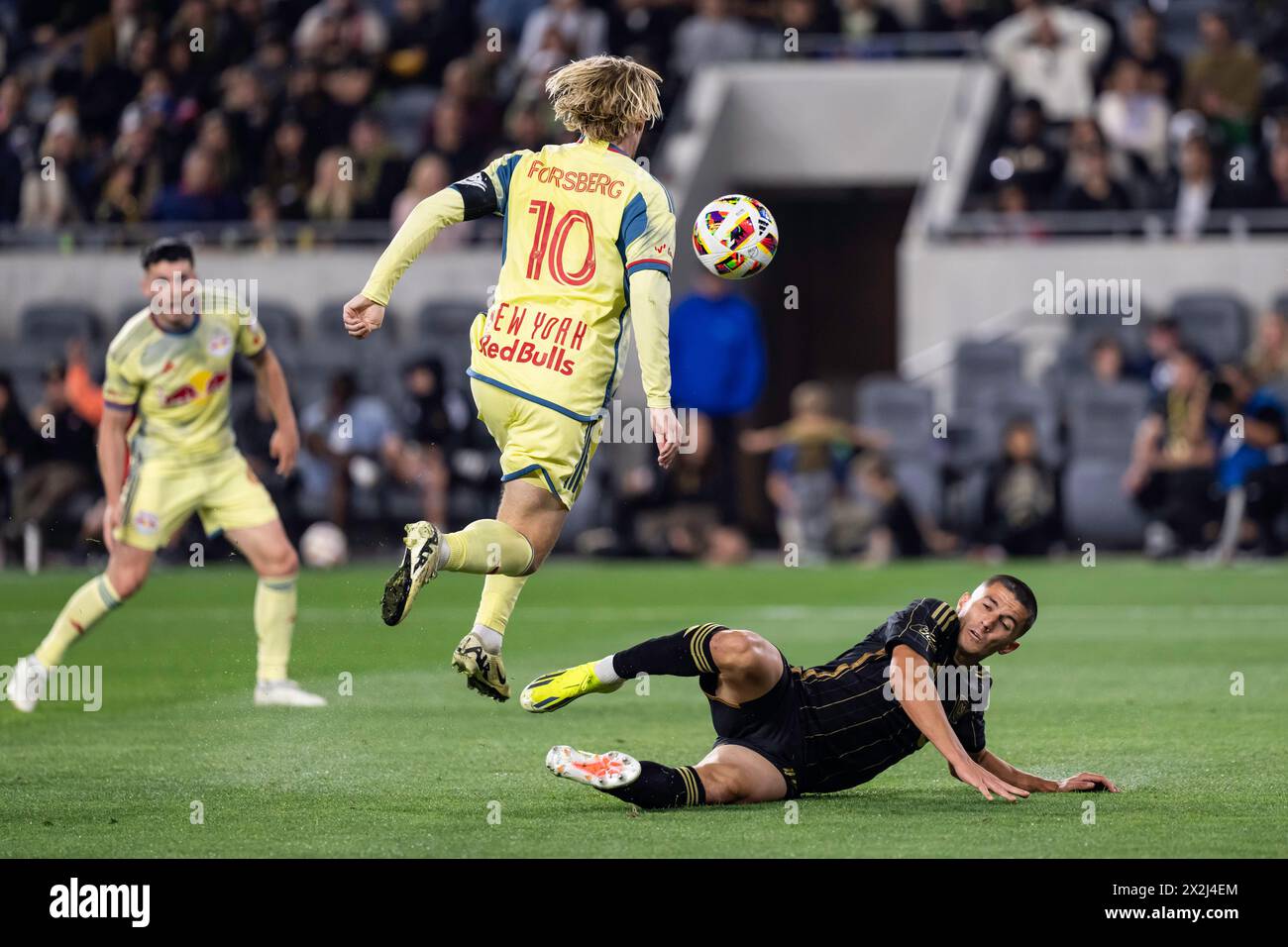 New York Red Bulls midfielder Emil Forsberg (10) avoids a slide tackle ...