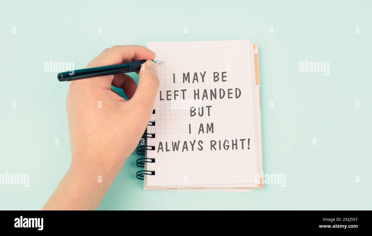 I may be left handed but I am right is standing on a notebook, writing ...
