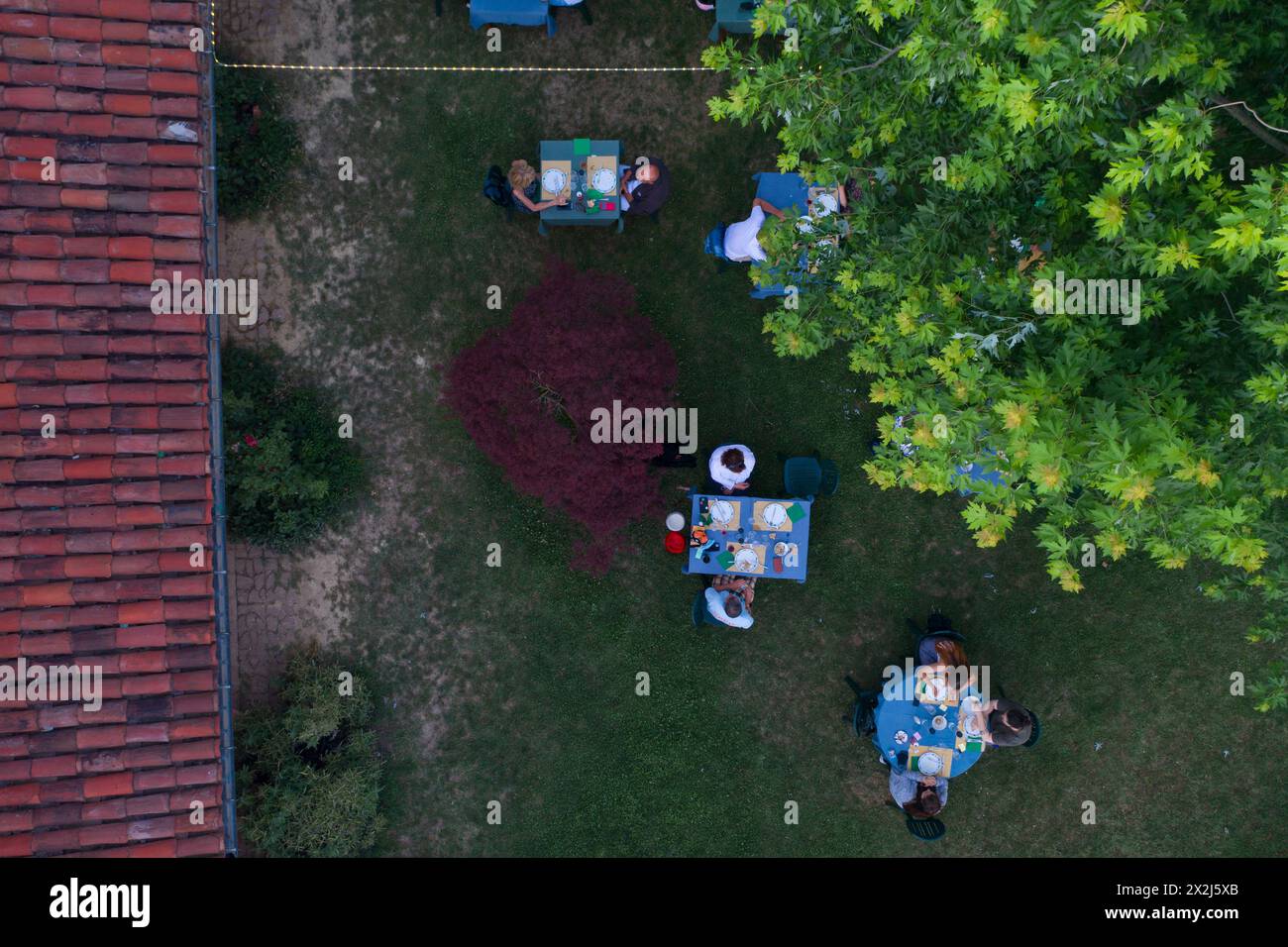 Top down shot of group of people sitting in a restaurant garden Stock ...