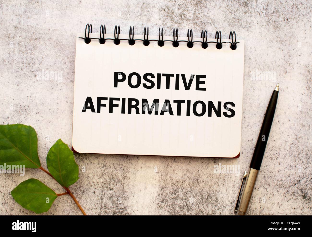 The text POSITIVE AFFIRMATIONS appearing behind torn paper Stock Photo ...
