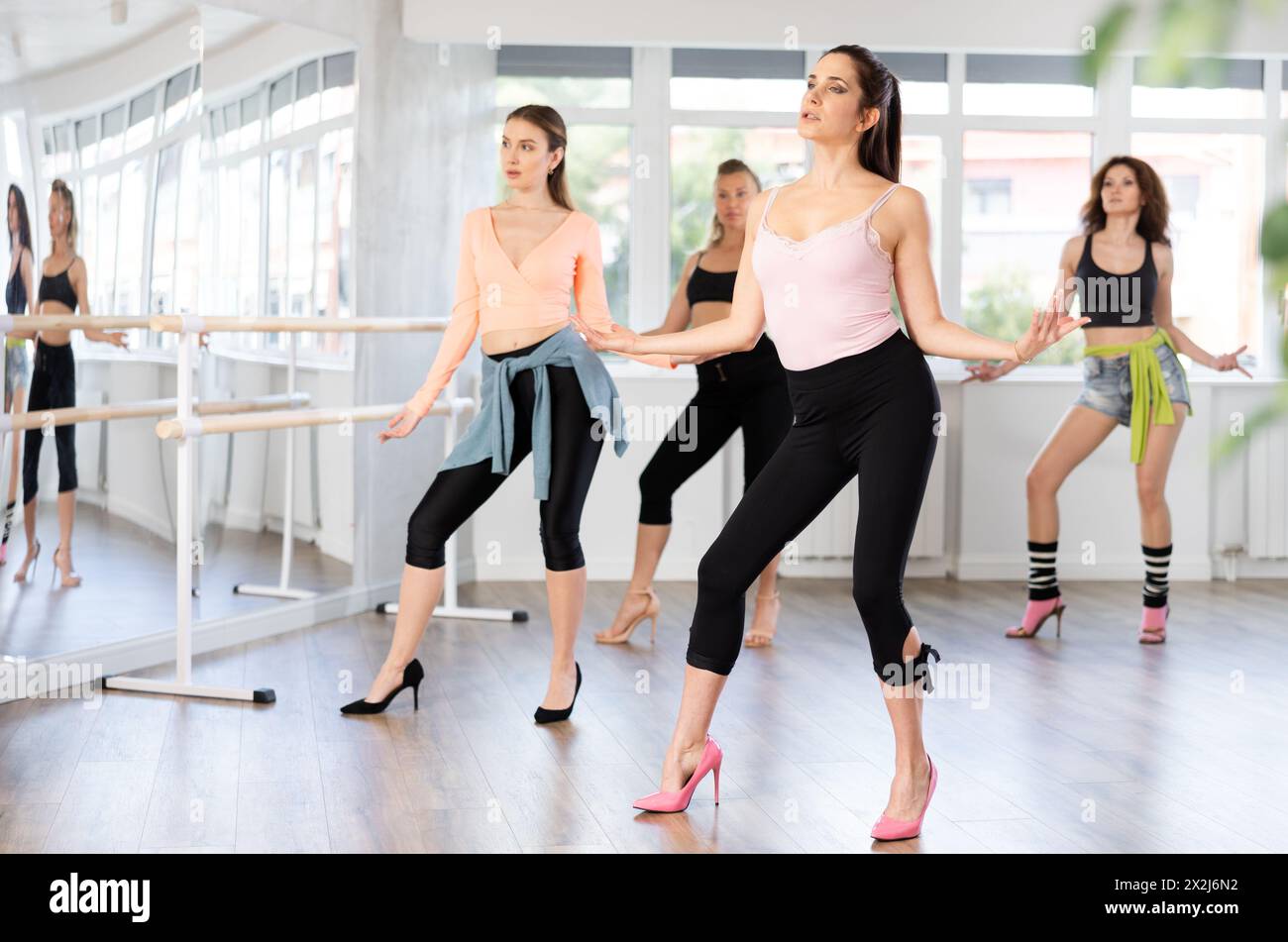 Group of women dancing high heels in studio Stock Photo - Alamy