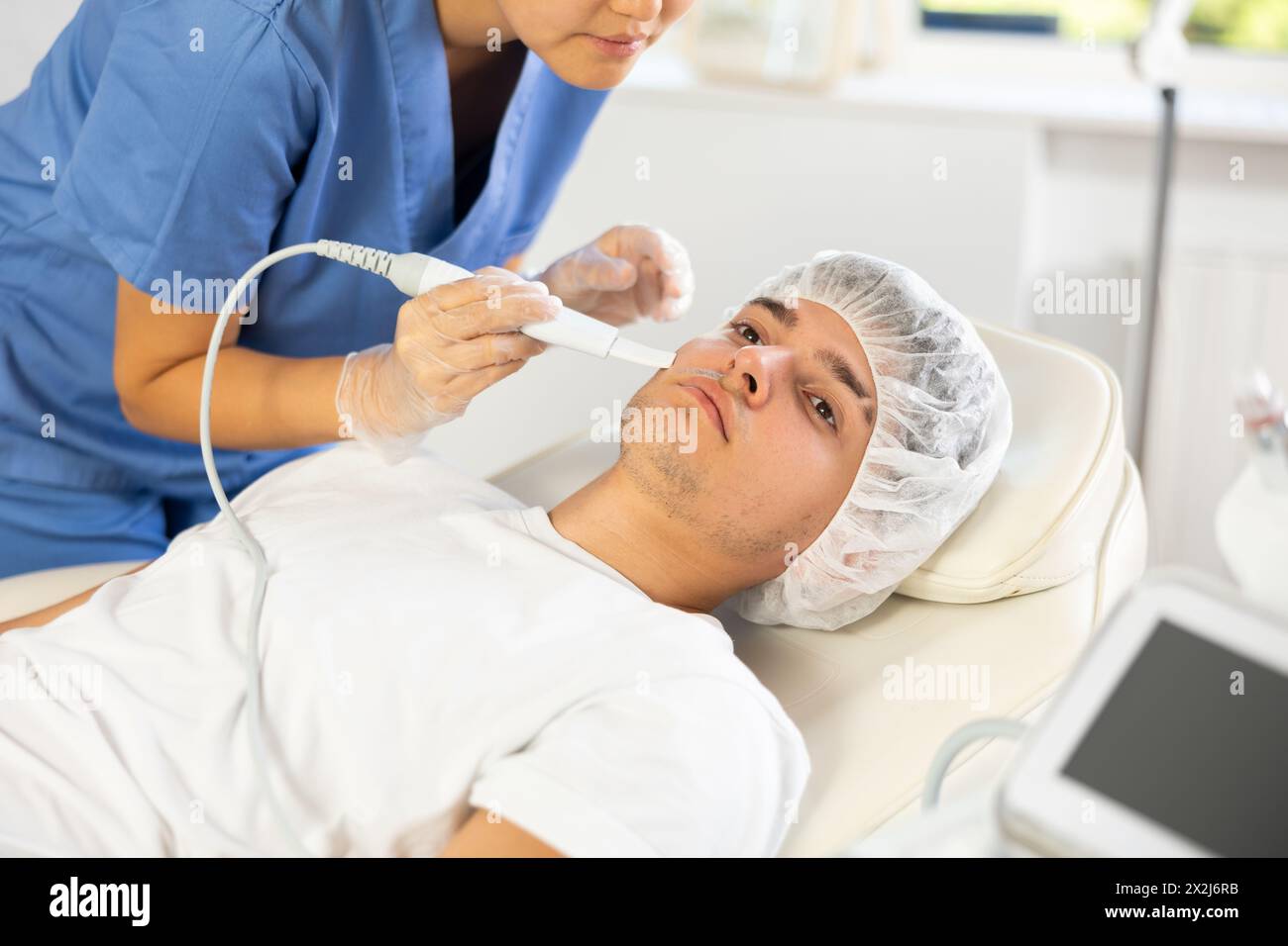 Using Skin Scrubber attachment Stock Photo - Alamy