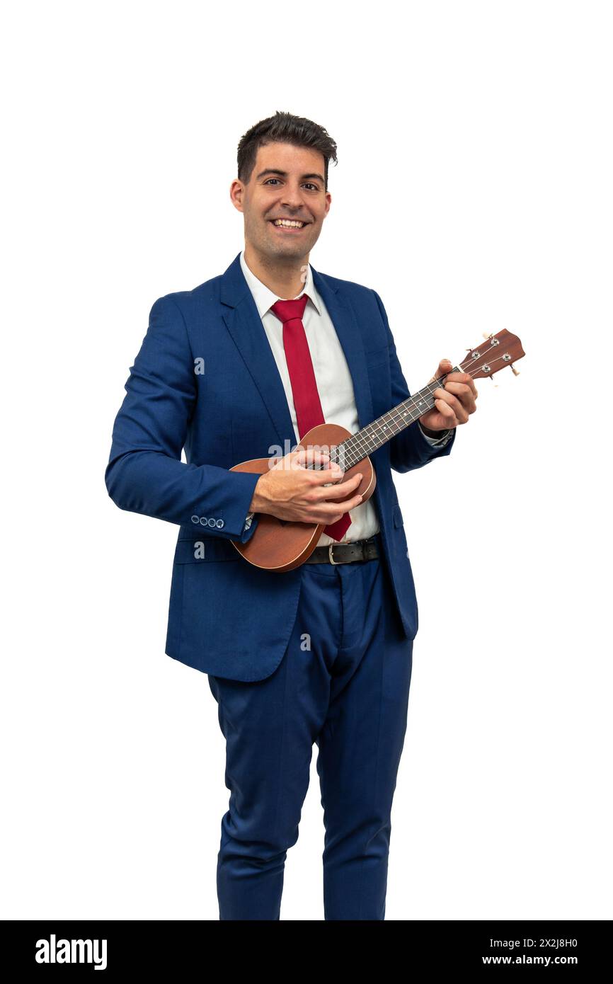 vertical businessman smiles while playing the ukulele. Embracing music ...