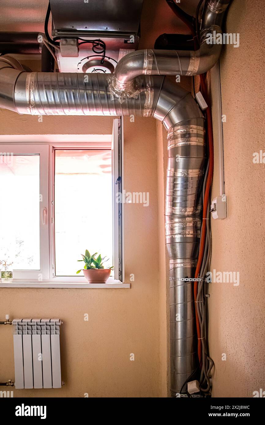 Ventilation pipes in building. Heating and cooling distribution ducts ...