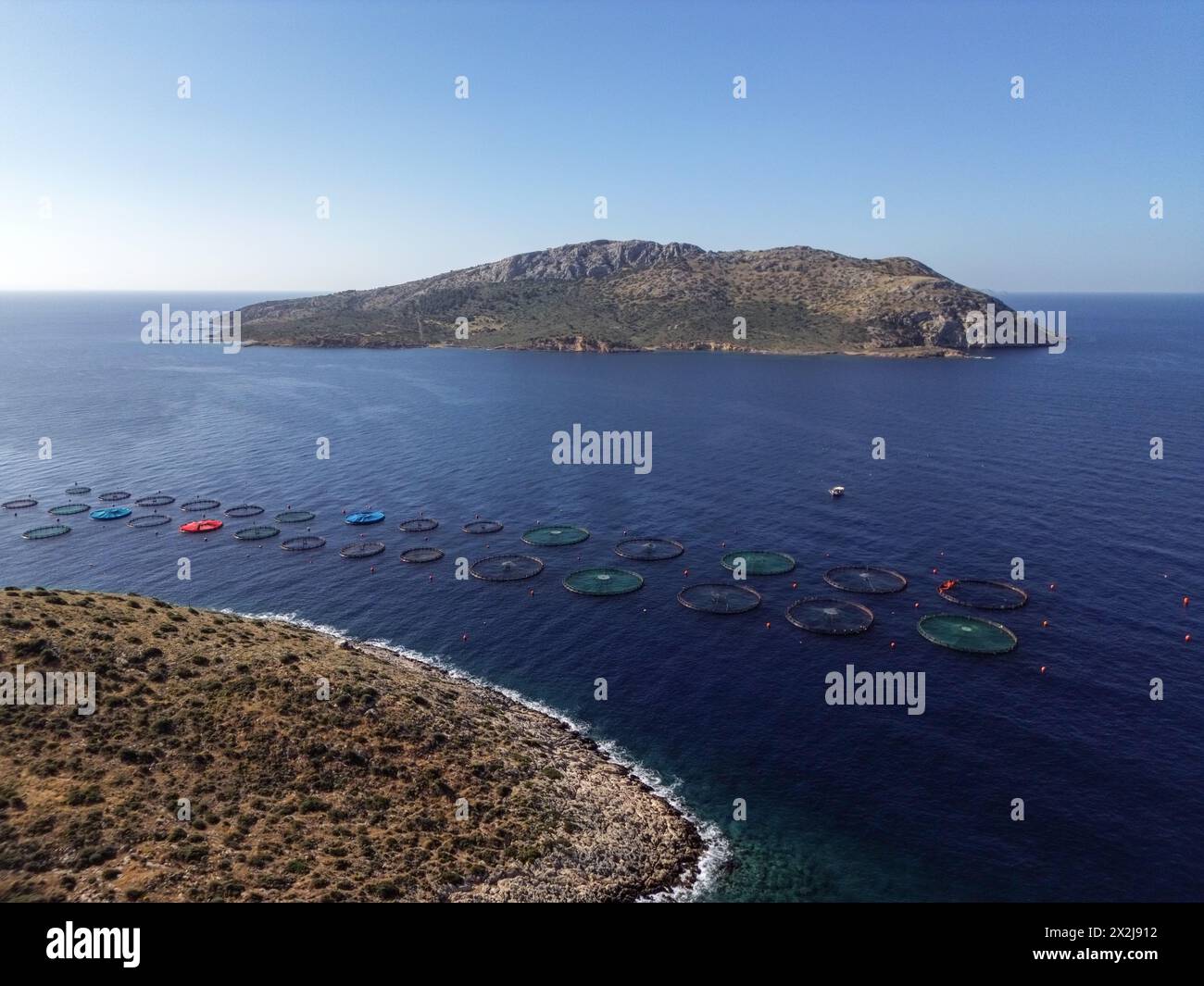 Athens, Greece. 19 April 2024. In an aerial view, the fish cages float ...