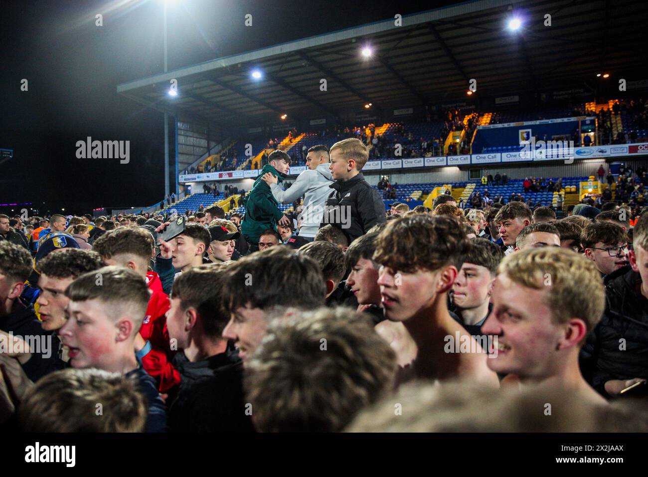 Mansfield, UK. 16th Apr, 2024. Mansfield Town fans celebrate promotion ...