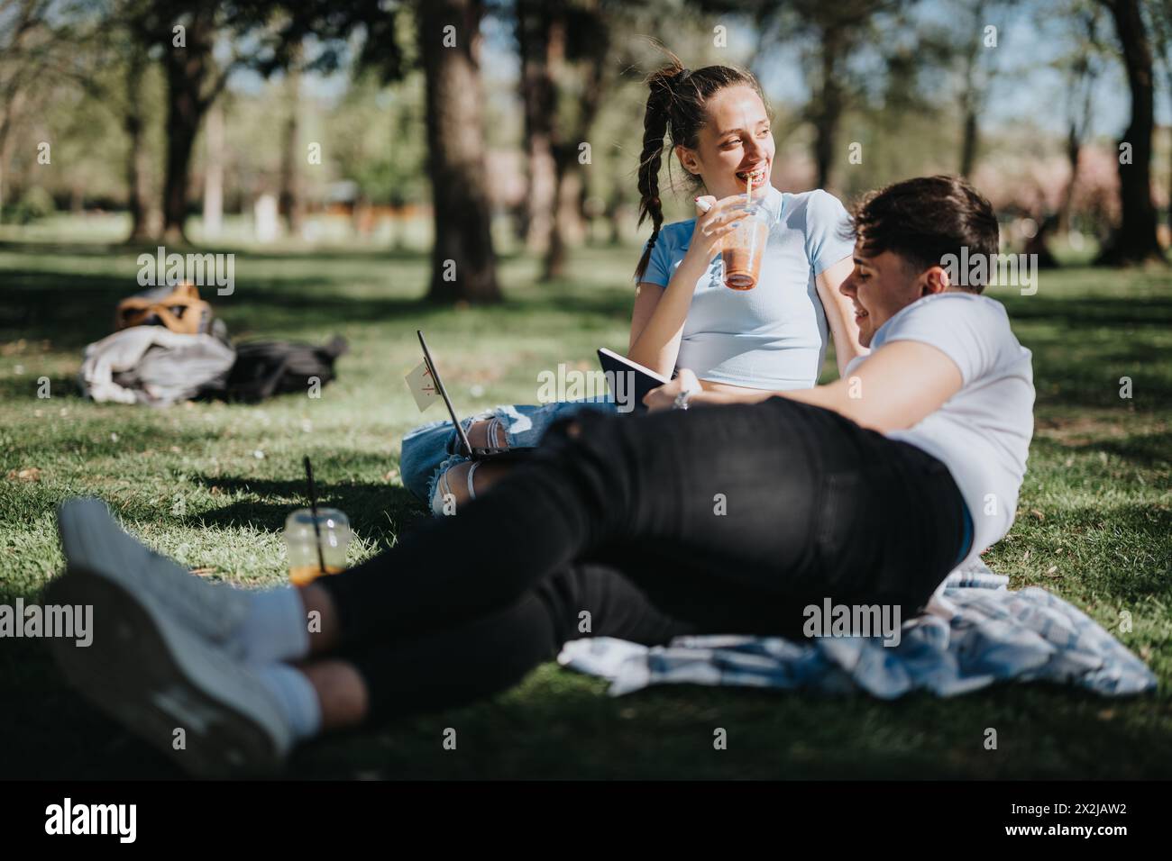 Students laying on grass hi-res stock photography and images - Alamy