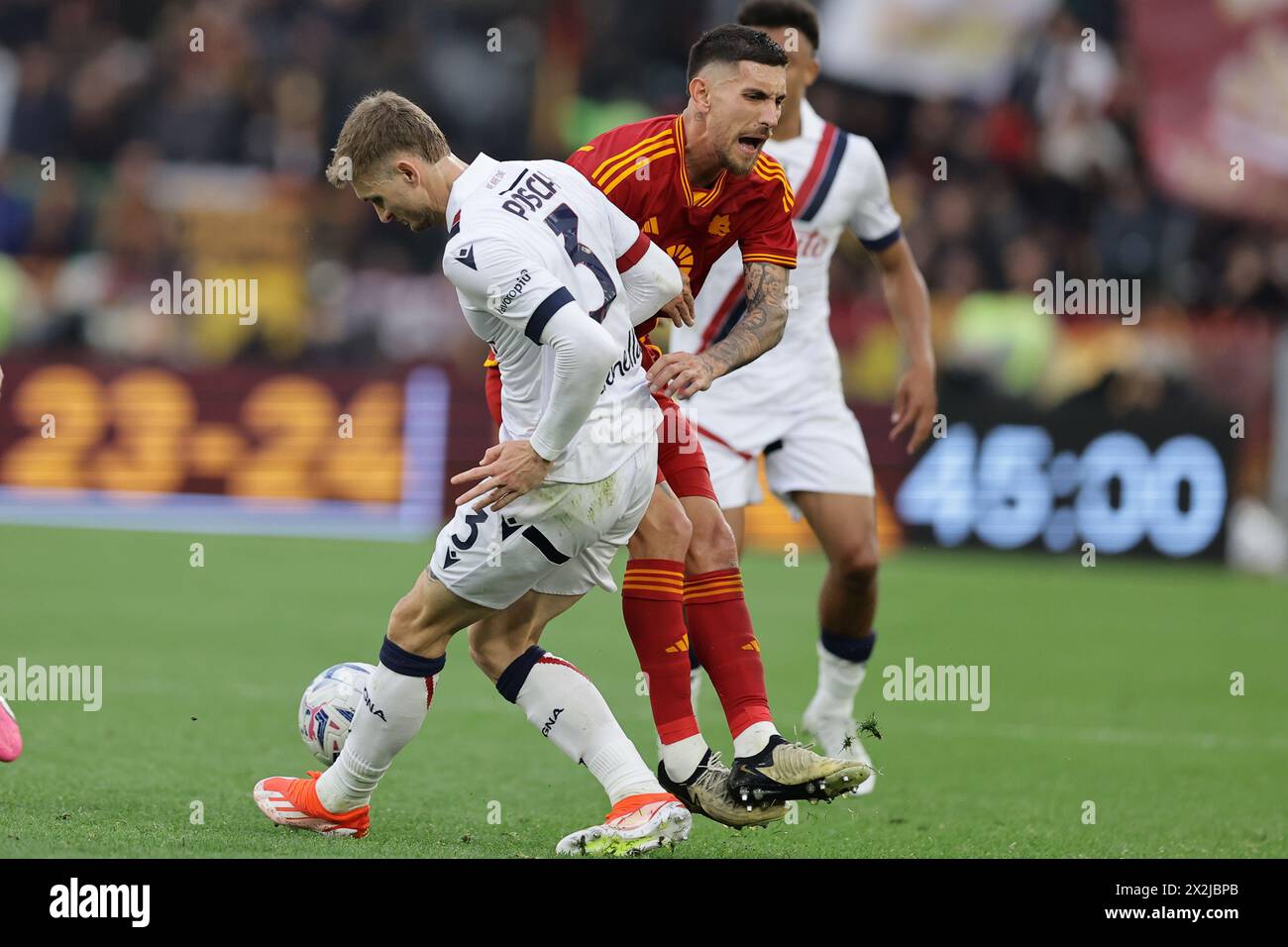 Roma’s Italian midfielder Lorenzo Pellegrini challenges for the ball ...