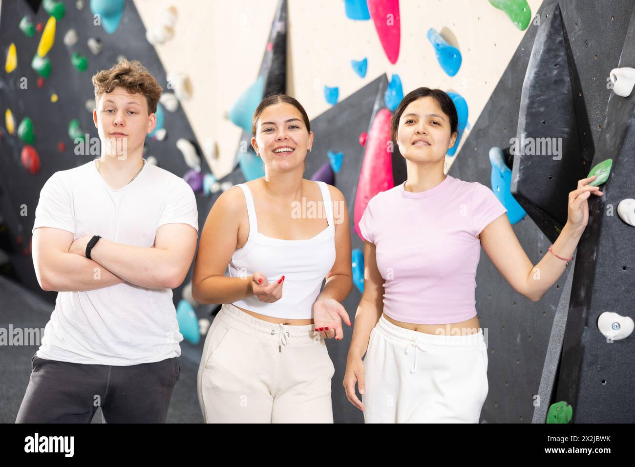 Portrait of three athletic people in climbing gym Stock Photo - Alamy