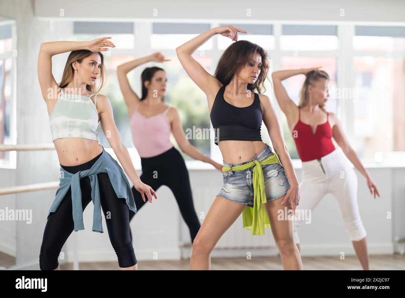 Group of women dancing high heels in studio Stock Photo - Alamy