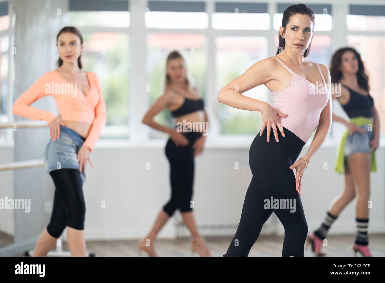Adult woman dancing high heels in group Stock Photo - Alamy