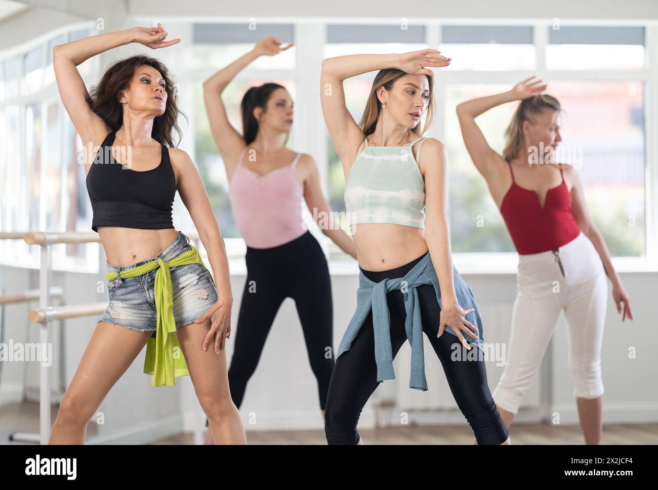 Group of women dancing high heels in studio Stock Photo - Alamy