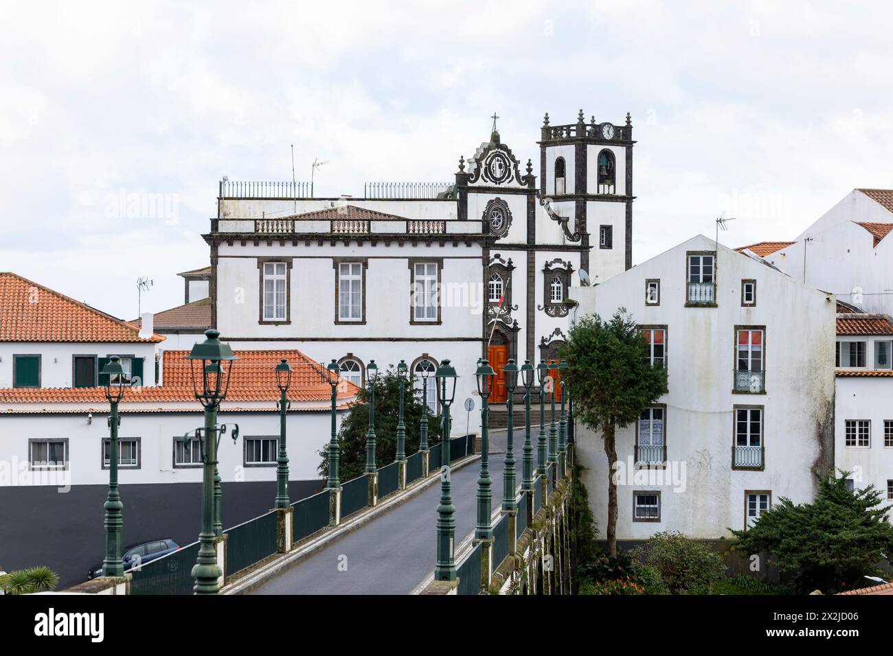 View of Nordeste old stone arch bridge in Nordeste village with white ...