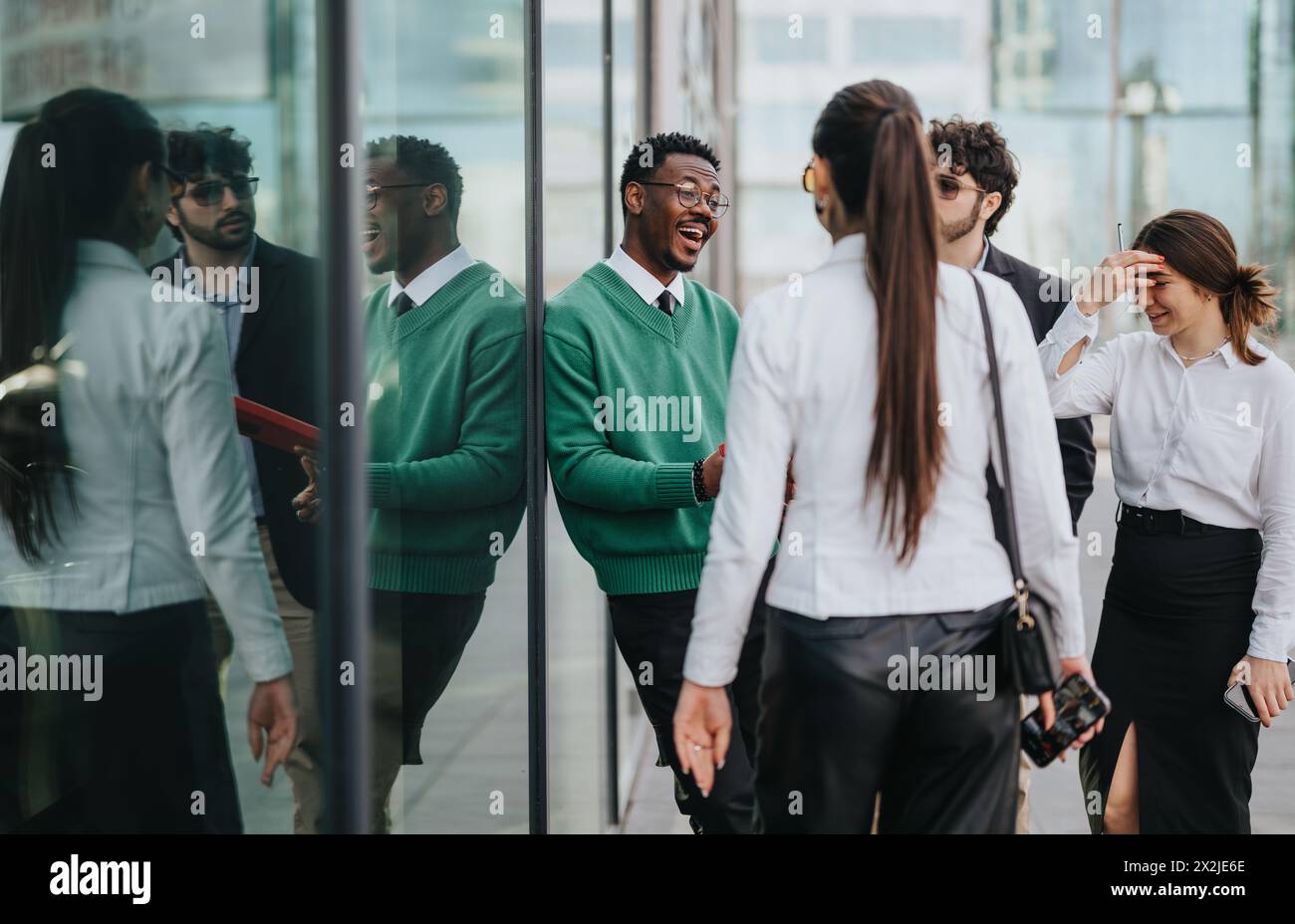 Young startup team in an urban setting engaged in a productive outdoor ...