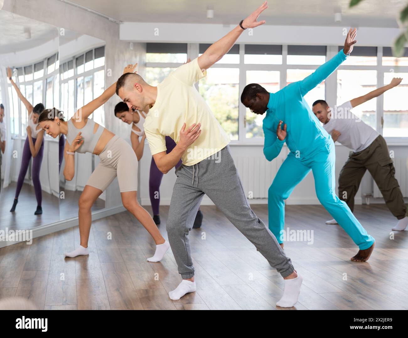 Young man practicing hip-hop dance in training hall Stock Photo - Alamy
