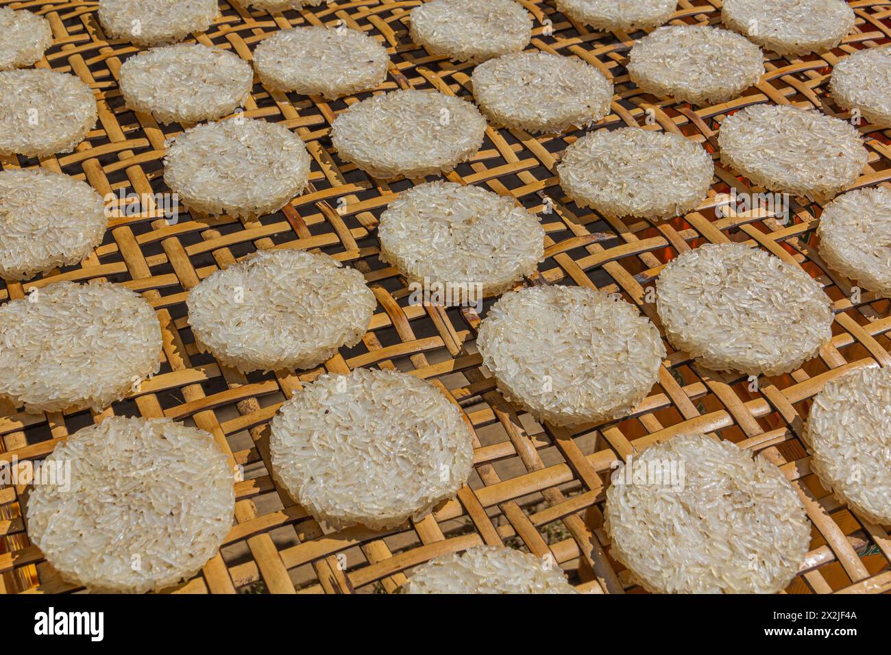 Rice cakes being dried in Muang Ngoi Neua village, Laos Stock Photo - Alamy