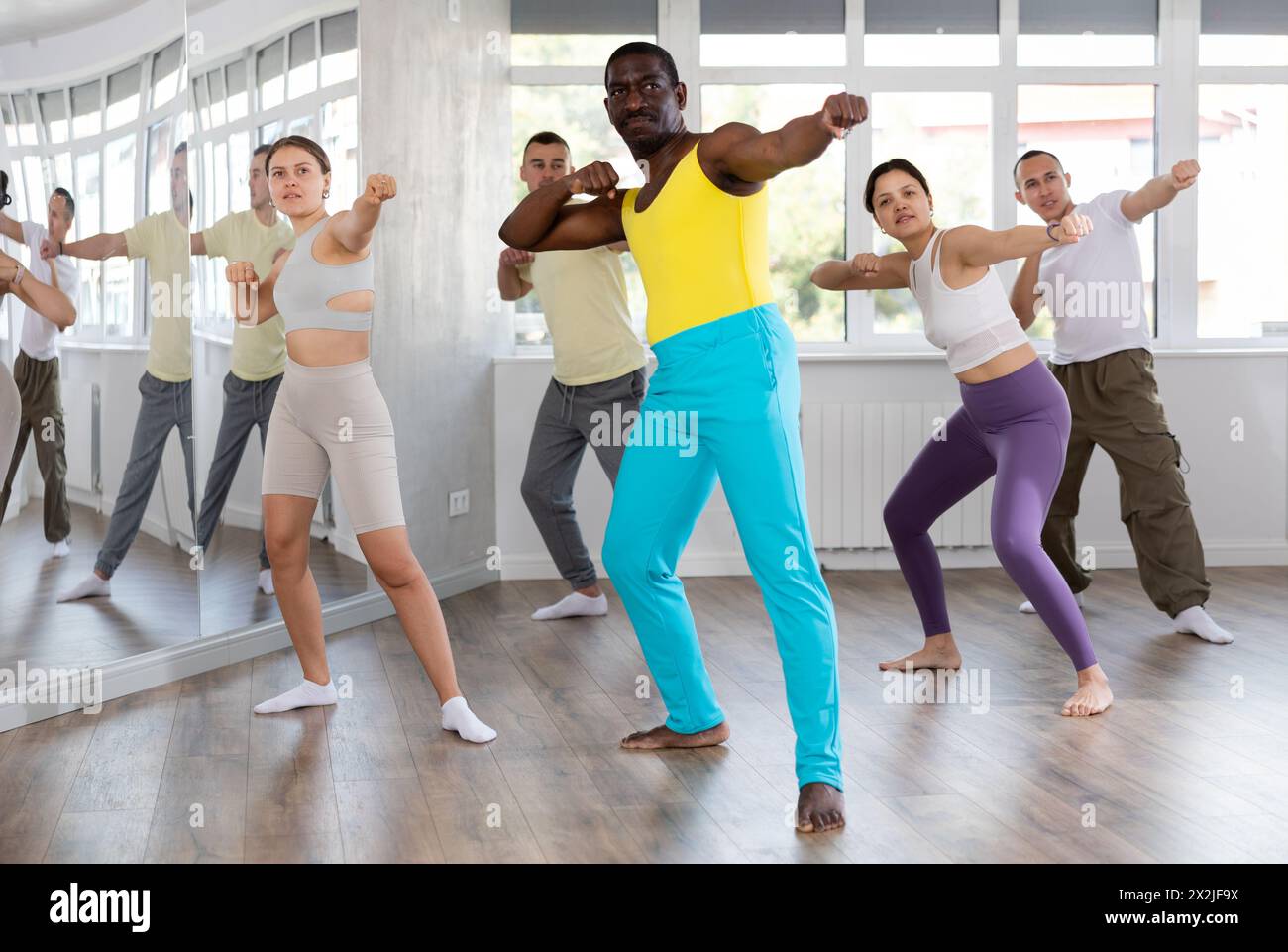 Middle-aged african-American man practicing Capoeira dance in training ...