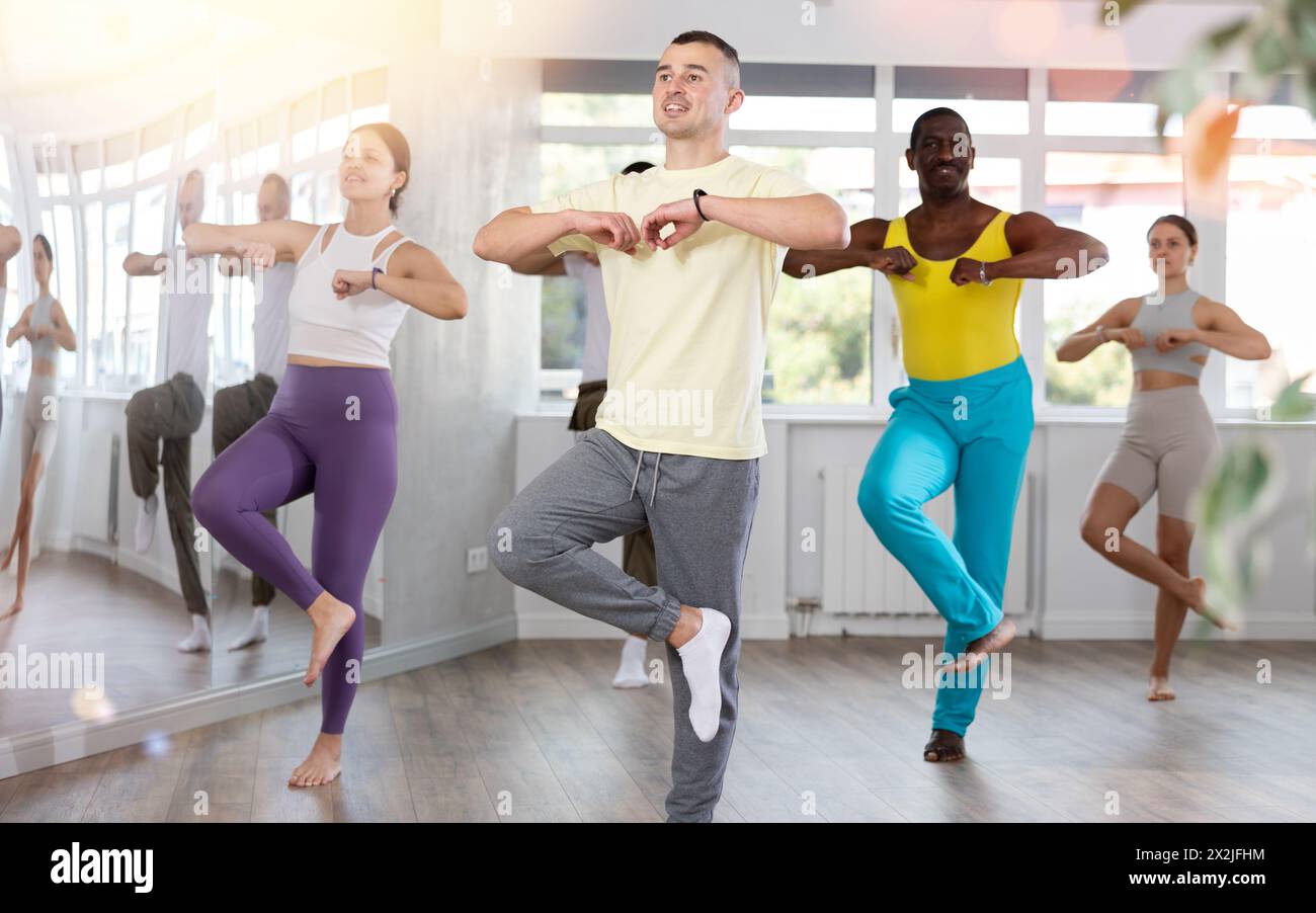 Group of multiethnic active people dancing and learning movements of ...