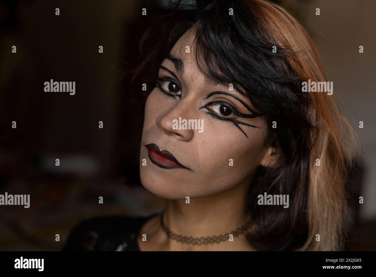 Portrait of a young transgender man (26) with makeup. Concept of ...