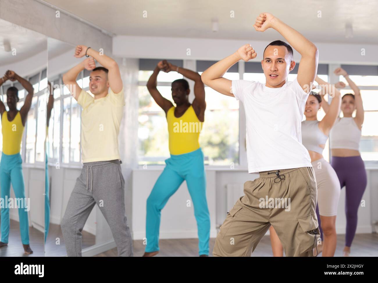 Young Asian man practicing hip-hop dance in training hall Stock Photo ...