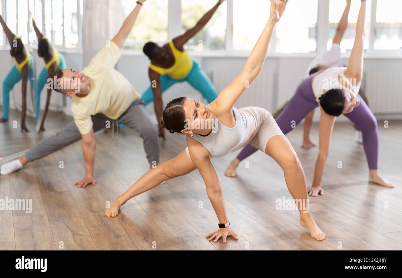 Group of people warming up before dance class Stock Photo - Alamy