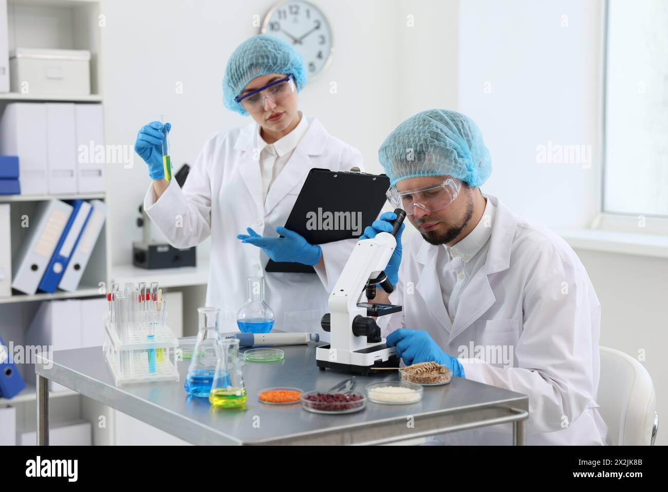 Quality control. Food inspectors checking safety of products in ...