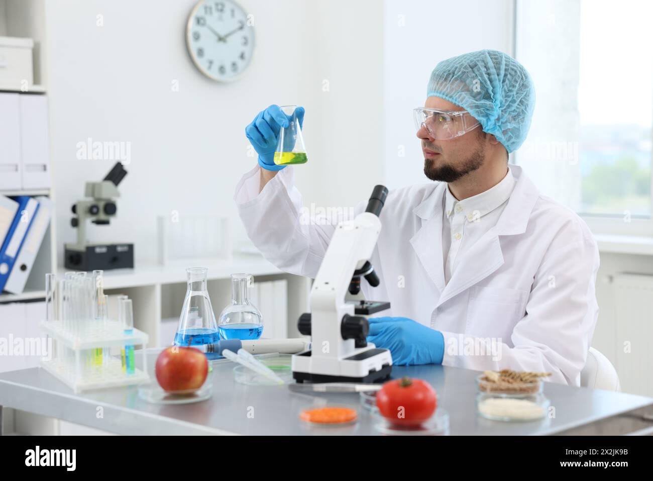 Quality control. Food inspector checking safety of products in ...