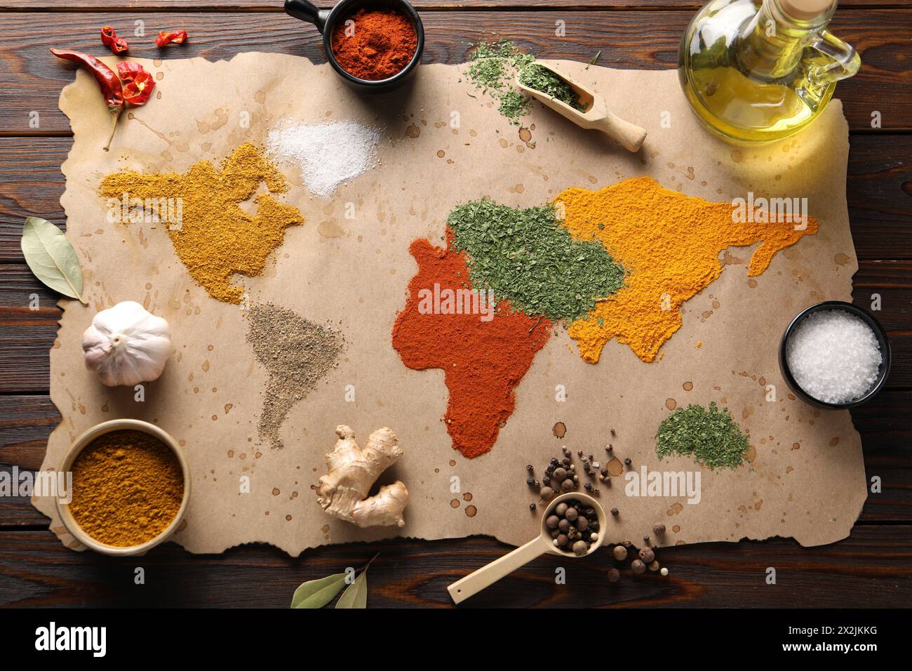 World map of different spices and products on wooden table, top view ...