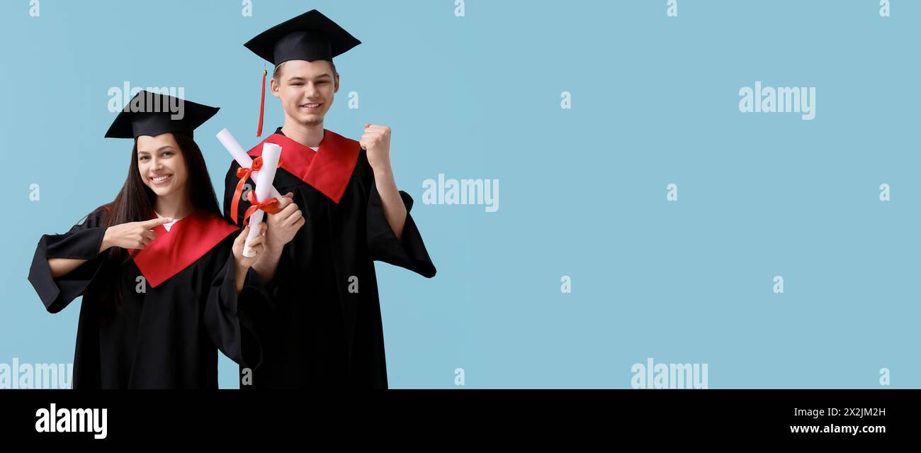 Happy graduating students on light blue background with space for text ...