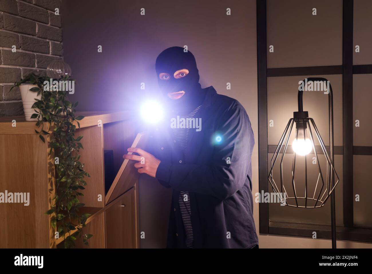 Man searching with flashlight in dark hi-res stock photography and ...