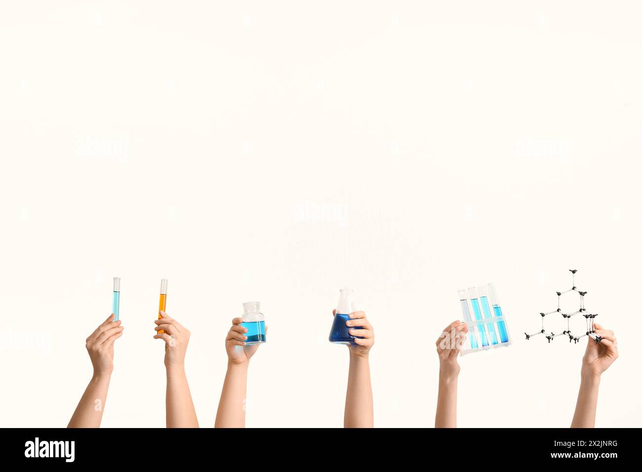 Female hands holding filled flask with bottle, test tubes and molecular ...