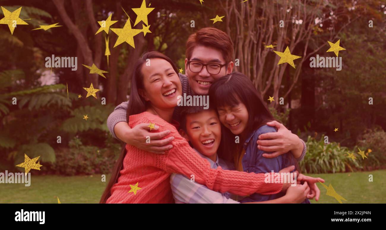 Image of gold stars over smiling asian parents, son and daughter ...