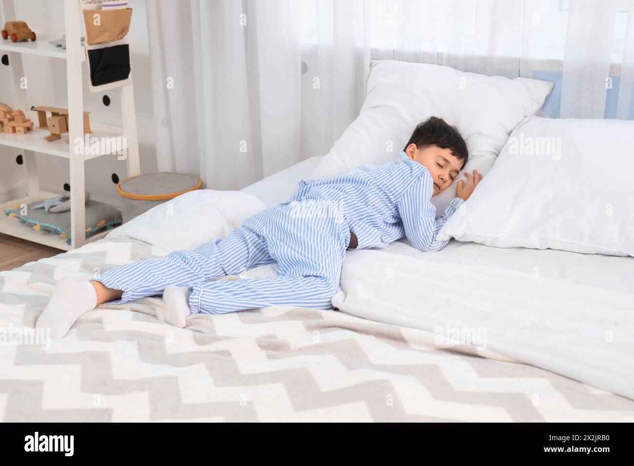 Cute little boy sleeping in bedroom Stock Photo - Alamy