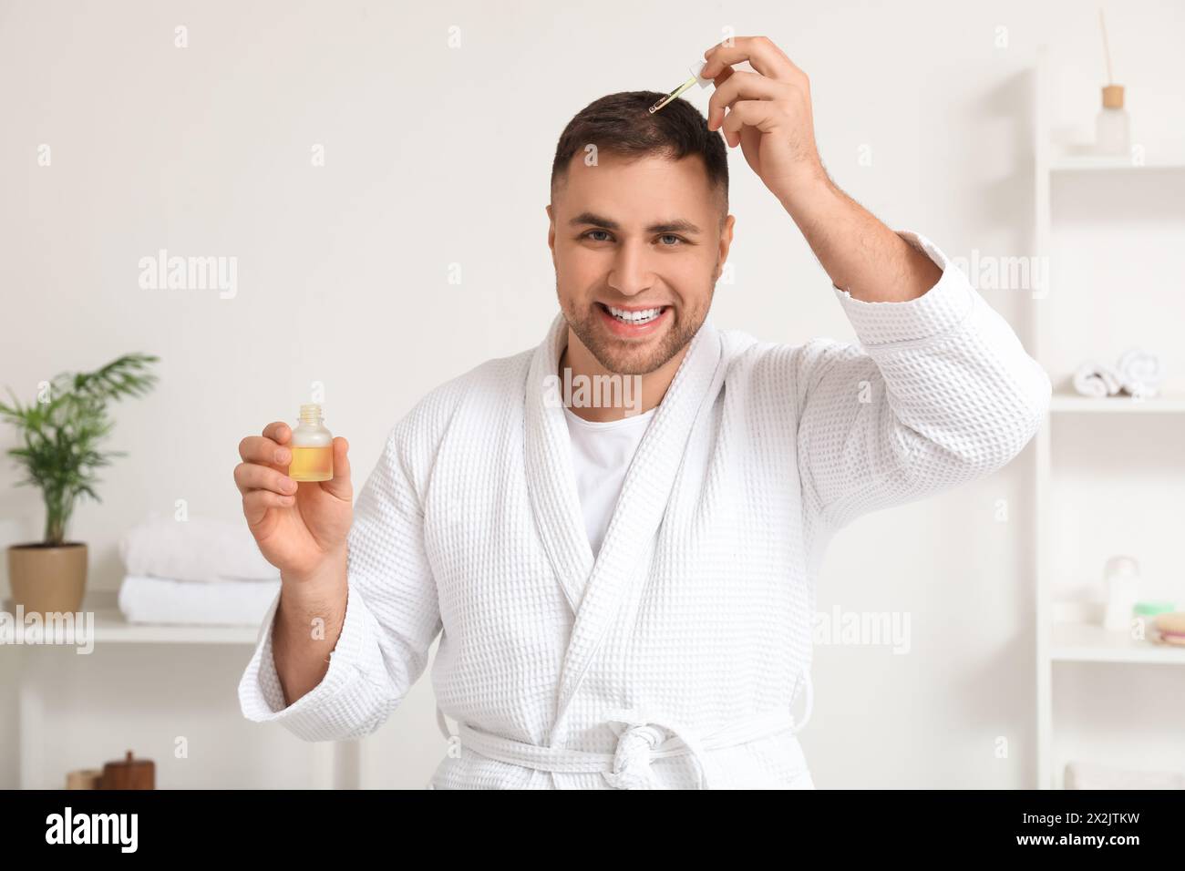 Young man using serum hi-res stock photography and images - Alamy