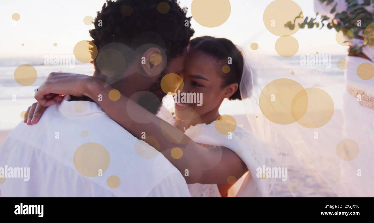 Image of light spots over african american couple getting married on ...