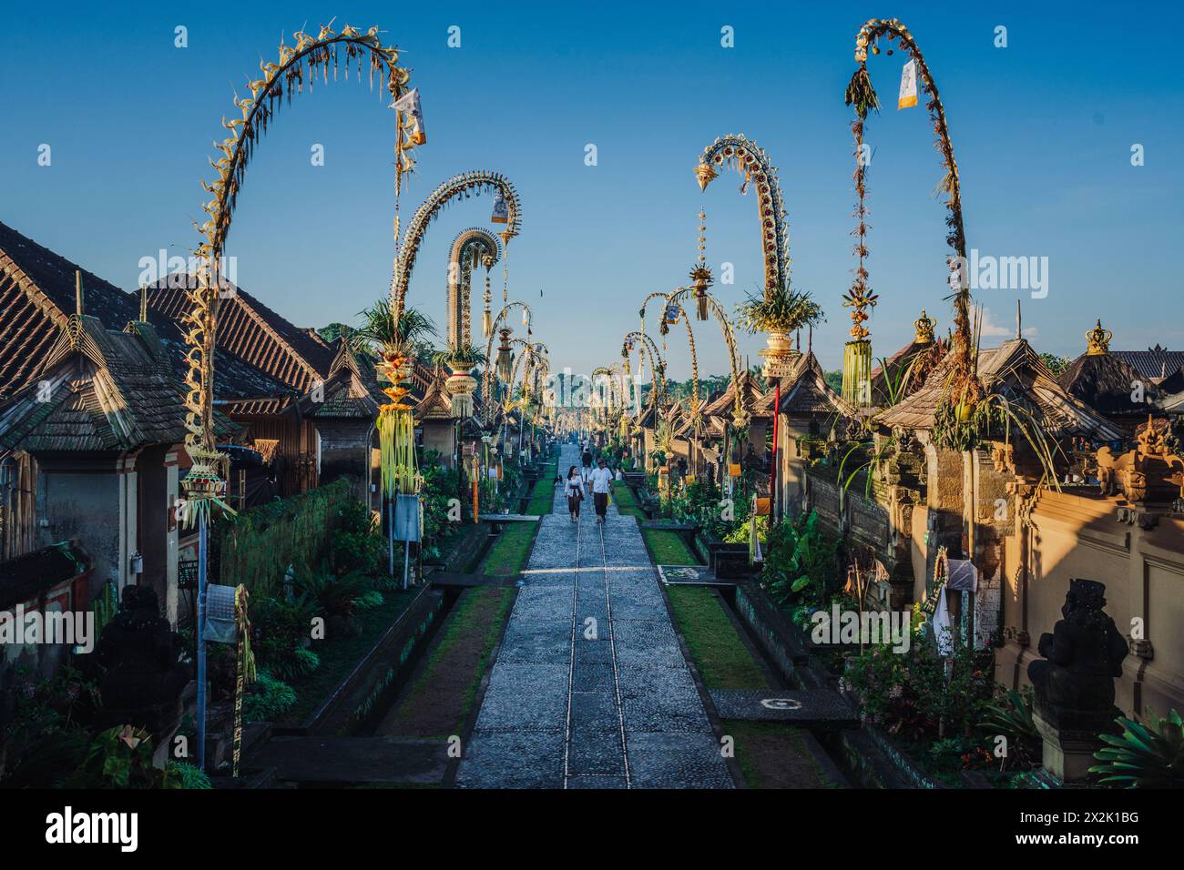 Scenic view of a traditional Balinese village street adorned with ...