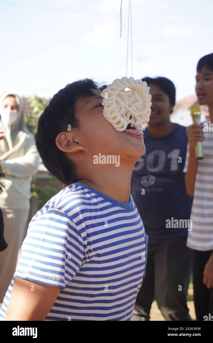 Children taking part in a cracker eating competition to commemorate ...