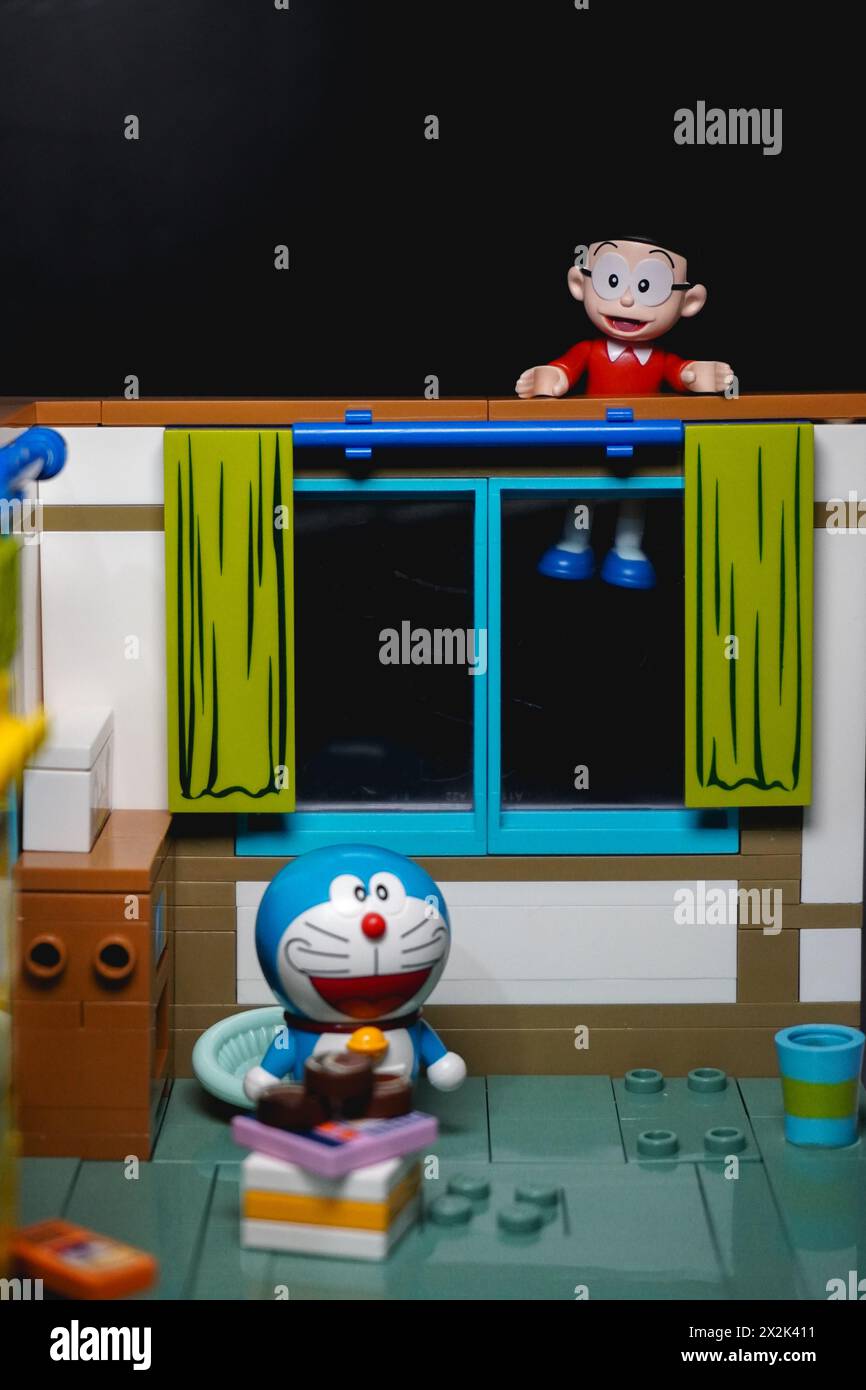The figure of Nobita peeking at Doraemon from outside the window Stock ...